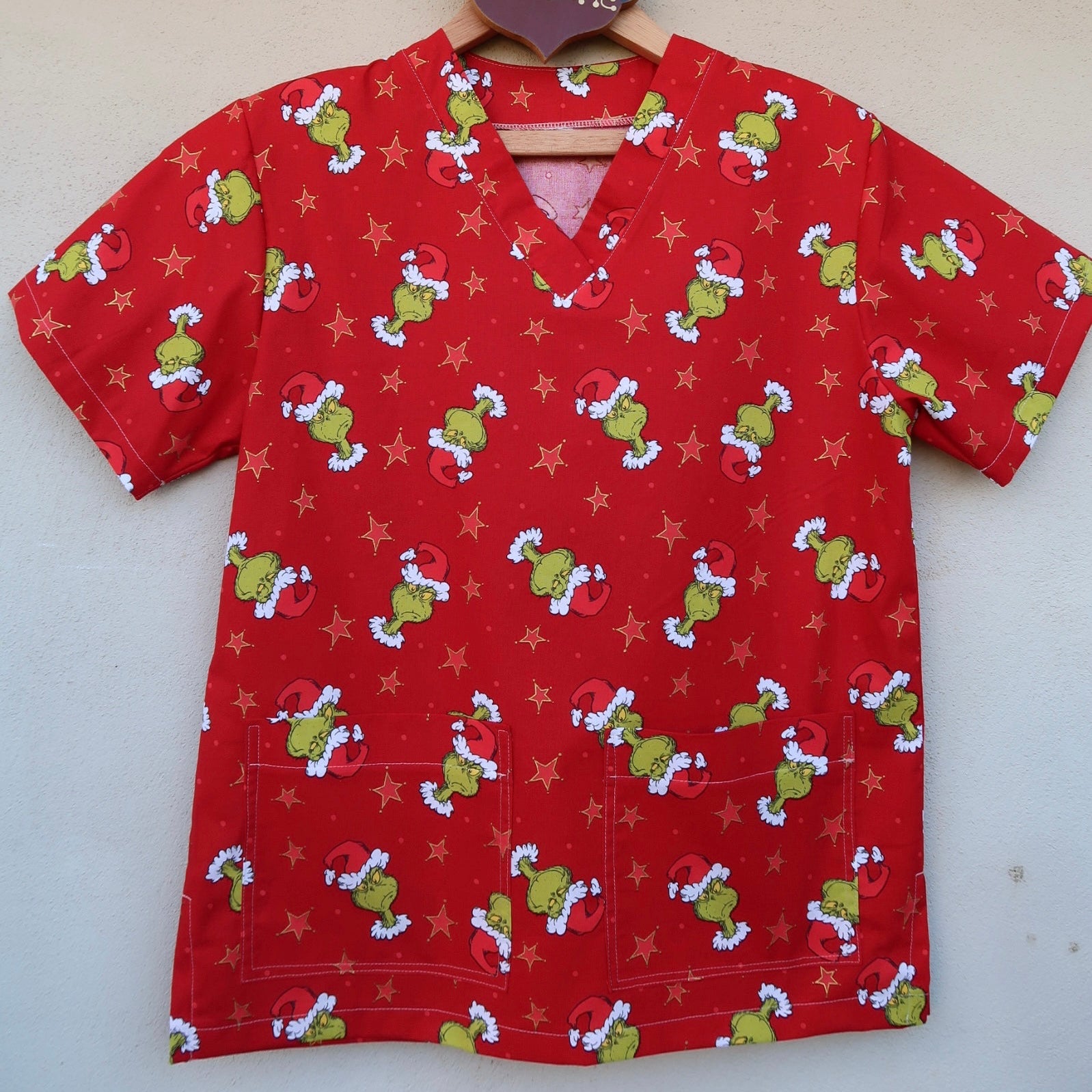 Red Grinch Scrub Top🎄 (M only) – Third Generation Threads